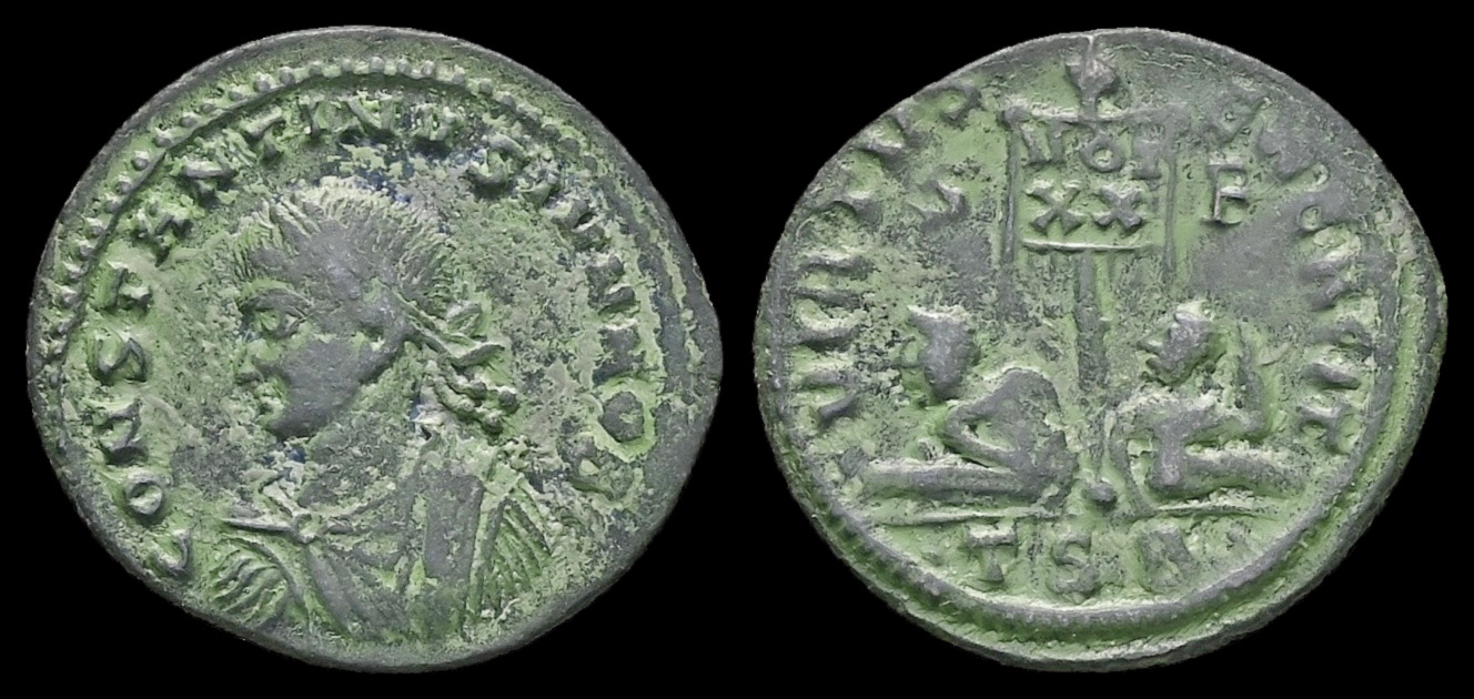 Constantine II, as Caesar AE follis two seated captives and inscribed ...