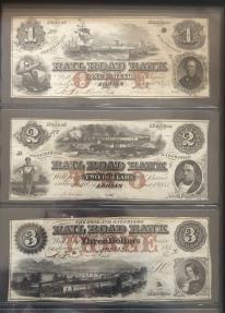 PAPER CURRENCY: Five Michigan Railroad Bank Notes, Framed In Protective ...