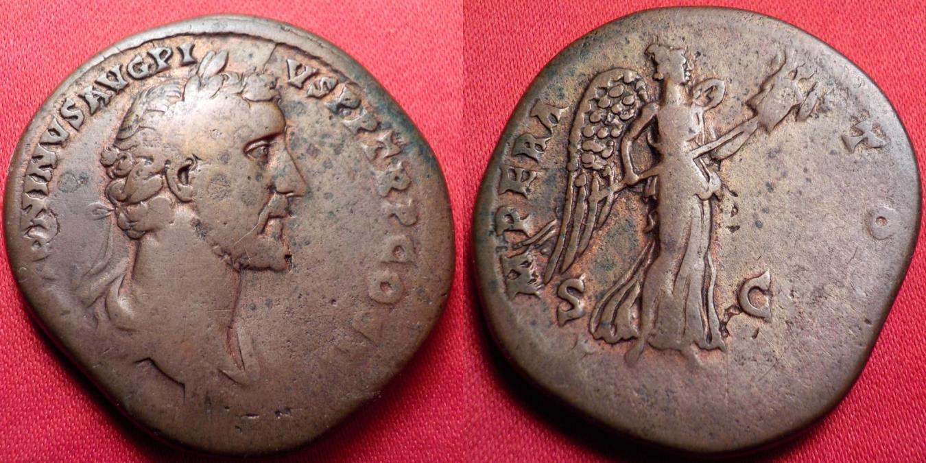 ANTONINUS PIUS AE sestertius. Victory flying right, holding trophy ...