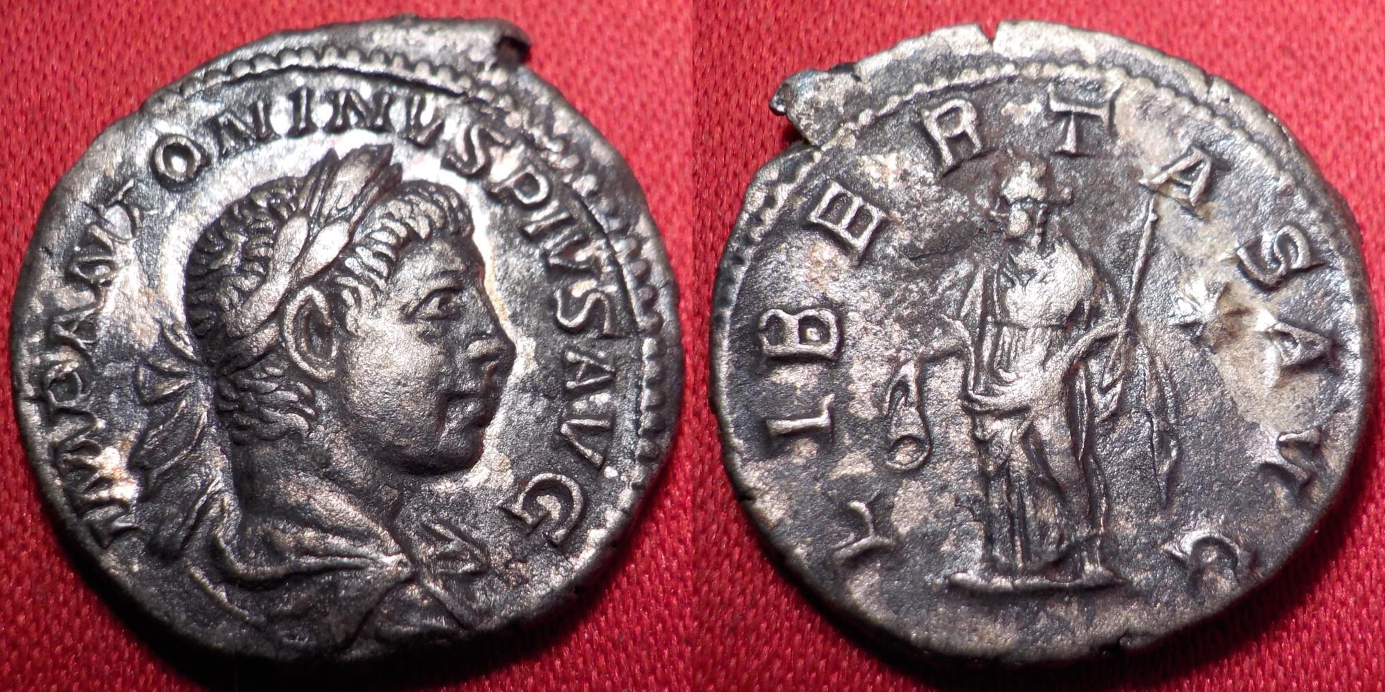 ELAGABALUS AR silver denarius. LIBERTAS AVG, Libertas standing, holding ...