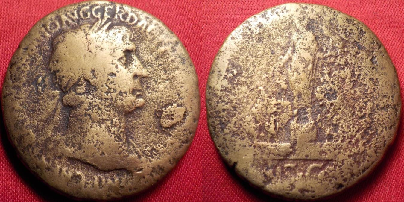 TRAJAN AE orichalcum sestertius. Emperor on dais, crowned by Victory ...