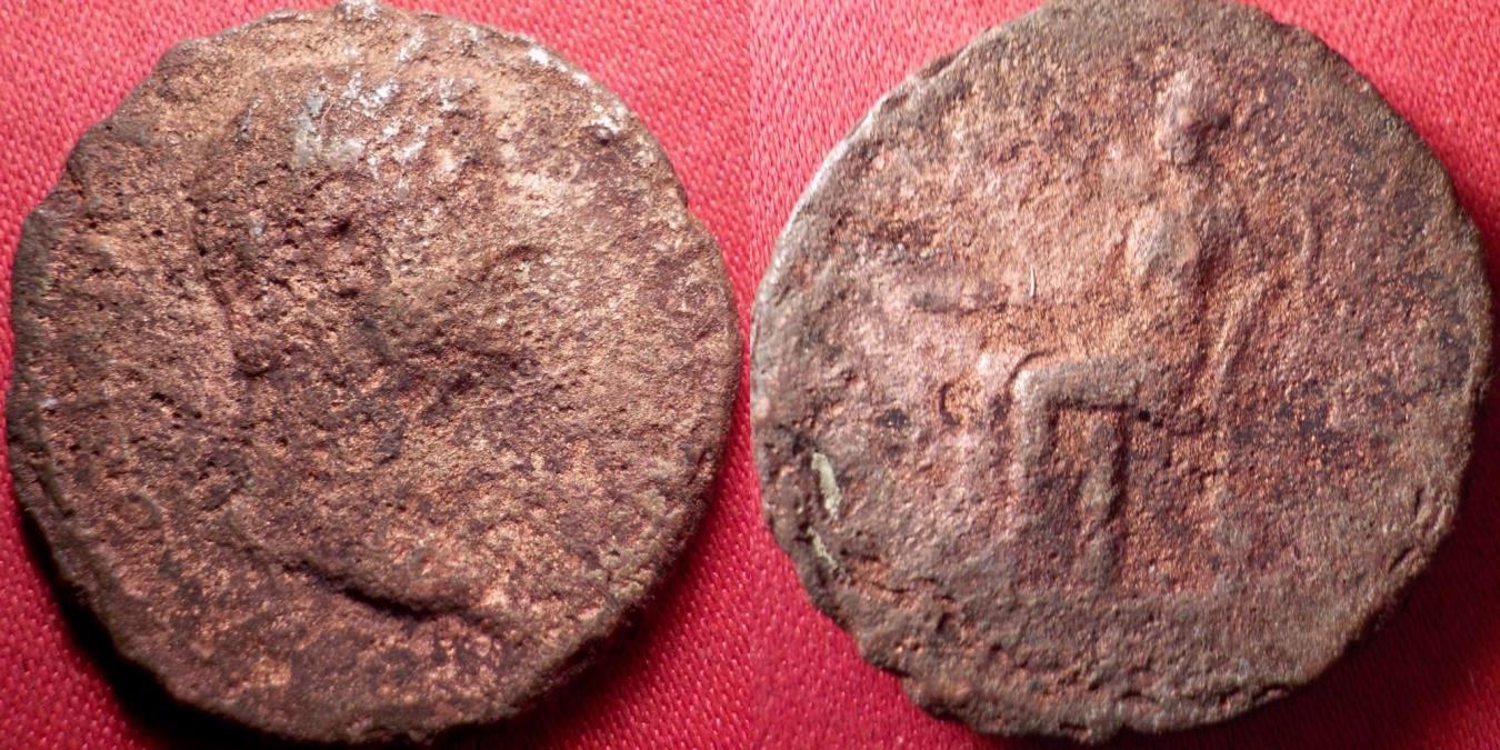 HADRIAN AE as. Justitia seated left, holding patera & scepter.