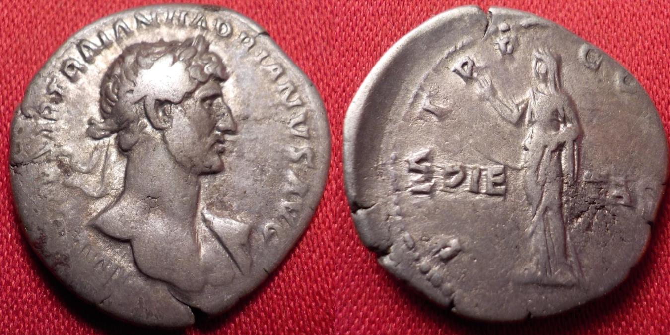 HADRIAN AR silver denarius Rome, 118 AD. Pietas standing, hand raised.