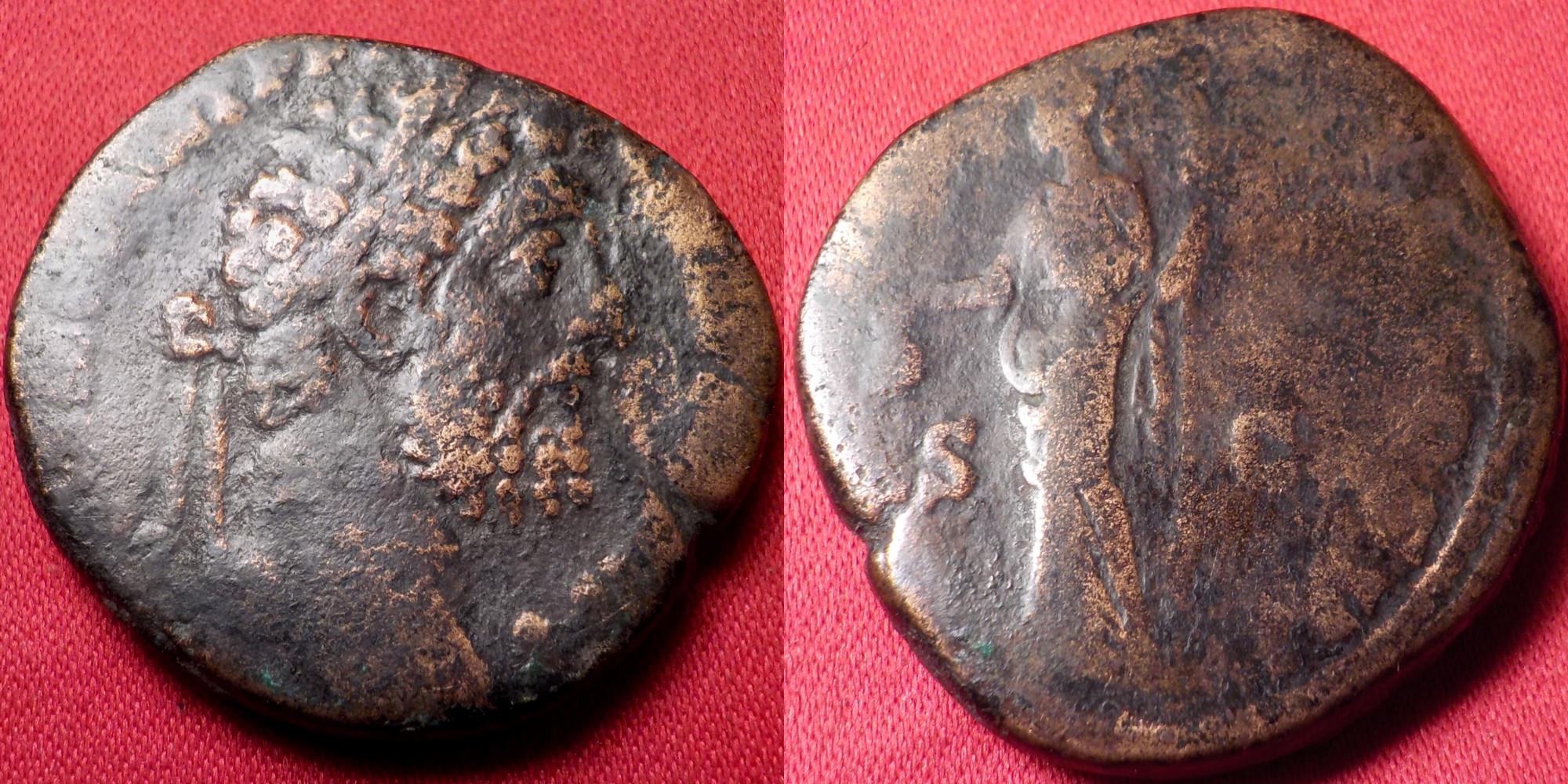 COMMODUS AE sestertius. Libertas standing left, holding pileus & scepter.