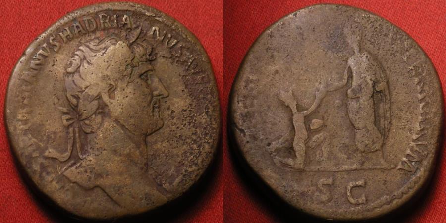 HADRIAN AE sestertius. RESTITUTORI ORBIS TERRARUM, Hadrian raising ...