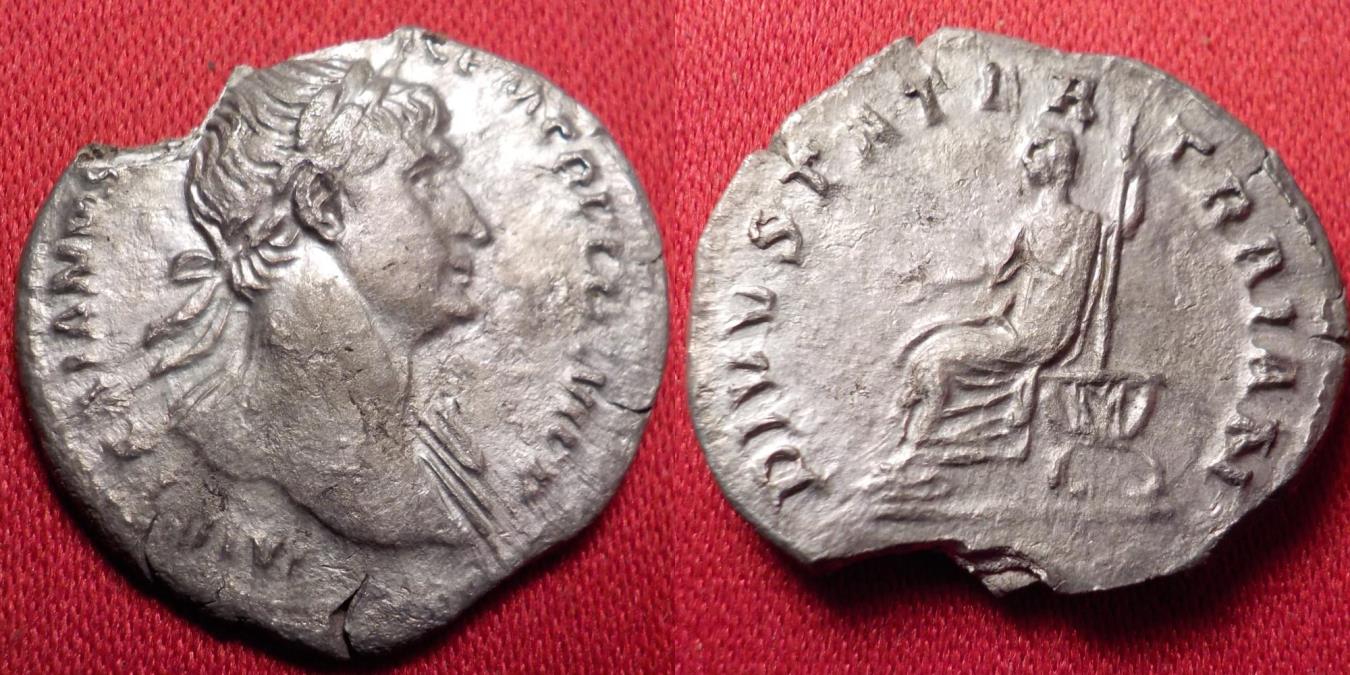 TRAJAN AR silver denarius. DIVUS TRAJAN PATER, Trajan's father seated ...