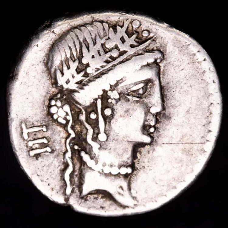 Julius Caesar. AR denarius (47-48 BC) CAESAR. Gallic trophy, holding ...